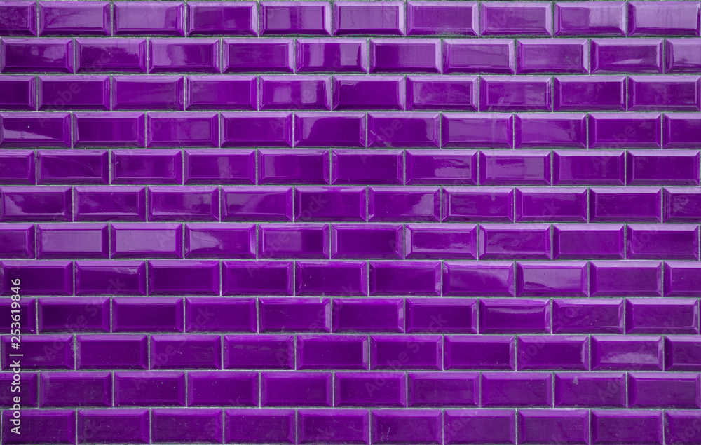 Shiny purple brick tiles on wall. Background texture Stock Photo ...