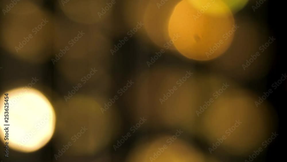 Gold Lens Flares and Refractions. Gold shimmering bokeh against a rich ...