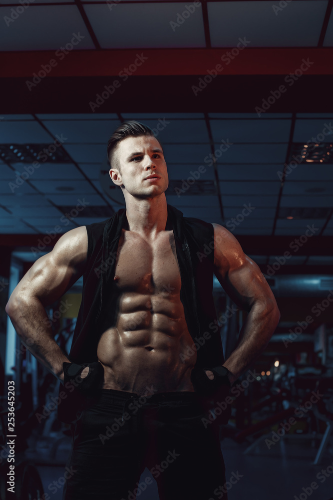 Muscular Model Young Man Exercising In Gym Portrait Of Sporty Strong