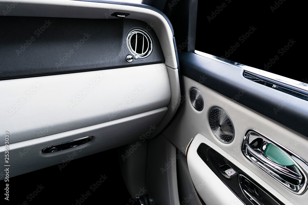 Door handle with power window control buttons of a luxury passenger car ...