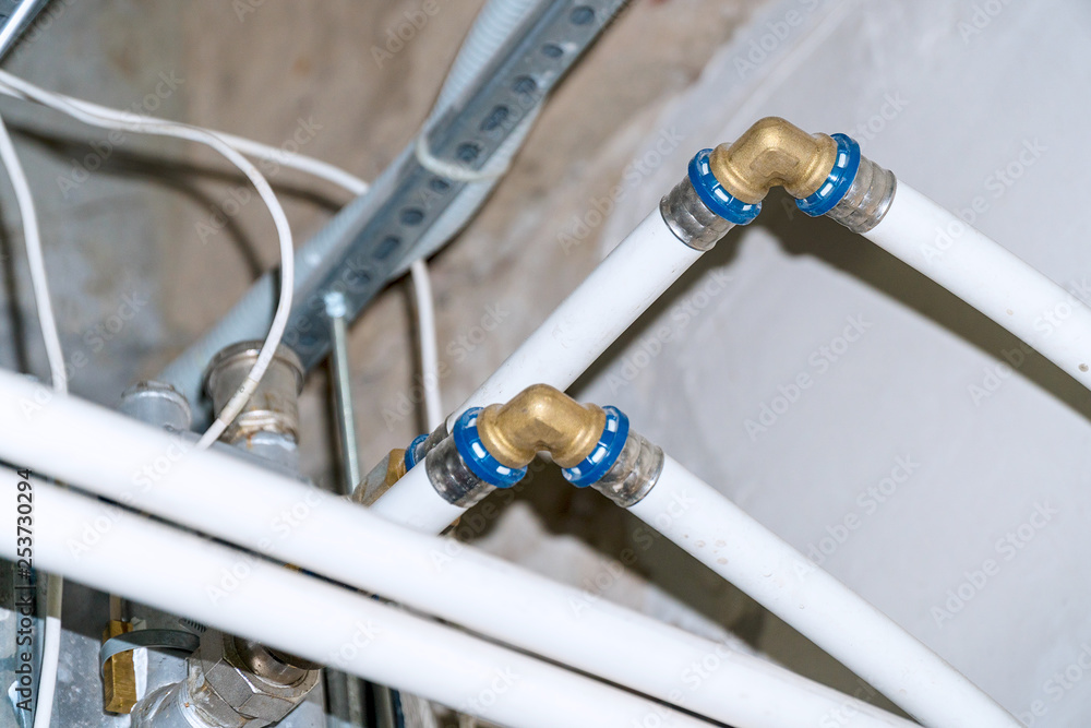 Connection of plastic pipes through fittings Stock Photo | Adobe Stock