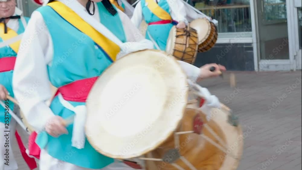 Korean national festival. A group of musicians and dancers in bright ...