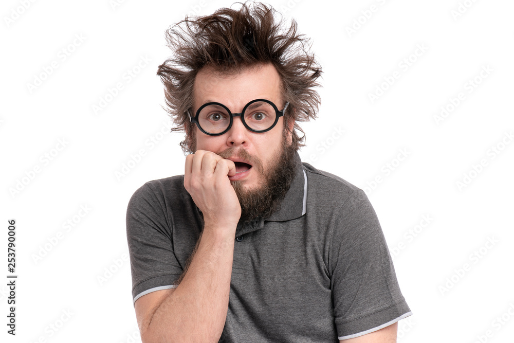 Crazy Scared Man with funny Haircut in eye Glasses, bites his nails and ...