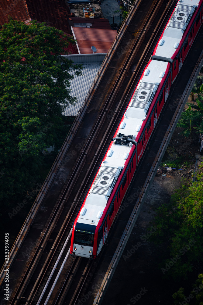 Aerial top down view shot involving of high speed train and road ...
