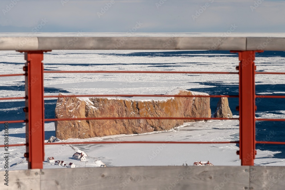 Winter view of the Percé Rock from the Percé UNESCO Global Geopark ...