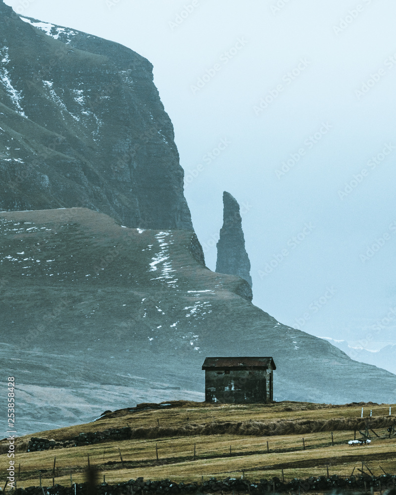 Stone building at the bottom of a mountain Stock Photo | Adobe Stock