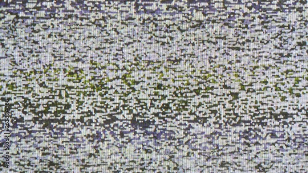 Close-up shot of loopable analog television static from an old TV ...