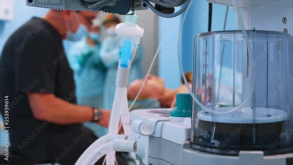 Operating room, patient preparation for surgery. Anesthesiologist with ...