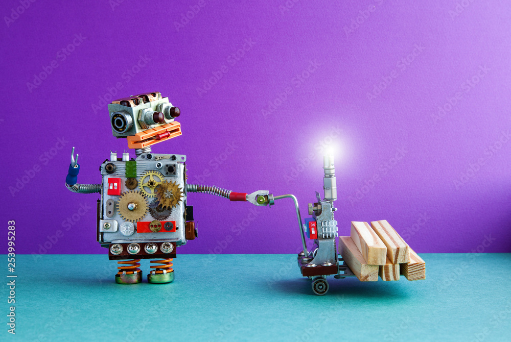 Foto Stock Robot loader moving powered pallet jack with wooden blocks ...