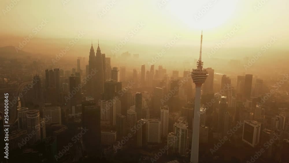 Menara Kuala Lumpur Tower with the sun. Aerial view of Kuala Lumpur ...