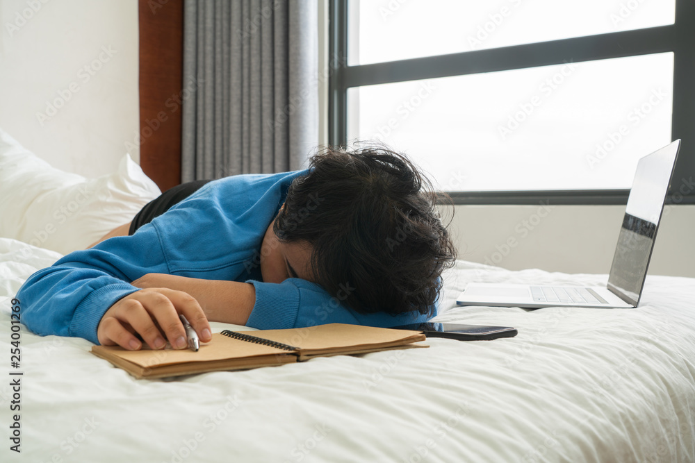 Asian girl sleeping on bed after working and writing Stock Photo ...