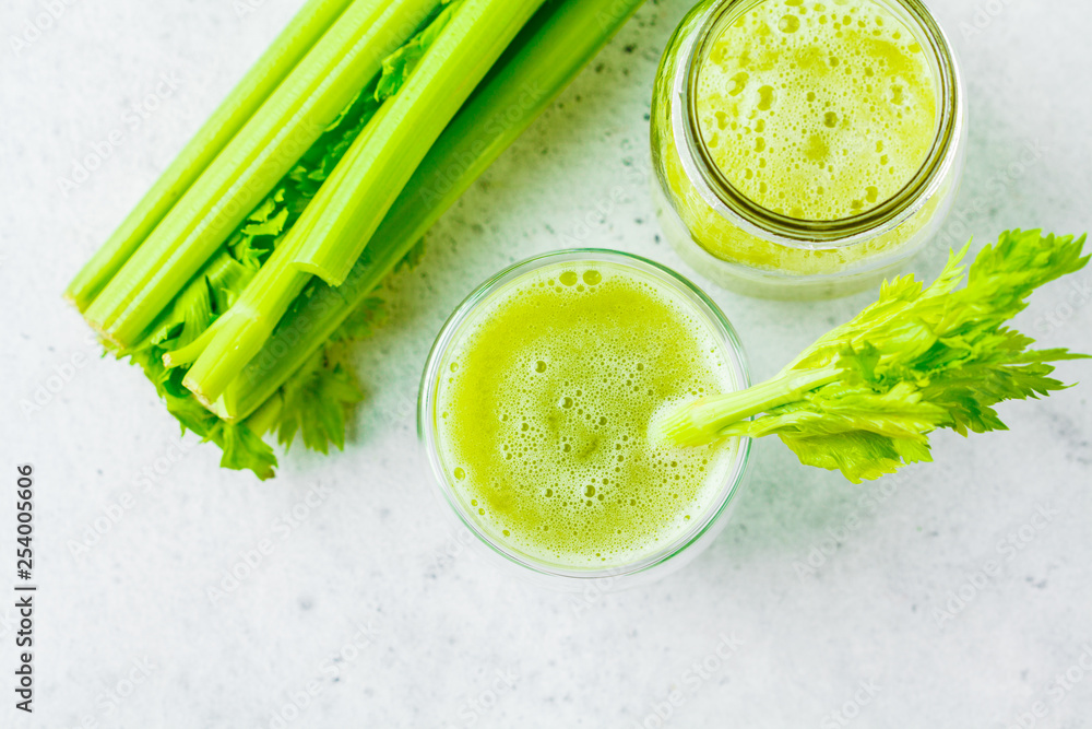 Green detox celery juice in a glass. Stock Photo | Adobe Stock