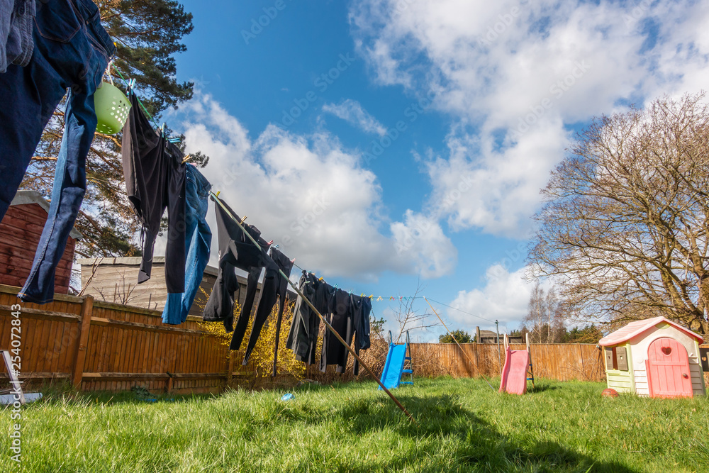 Clothes drying outside on a washing line on a windy day Stock Photo ...