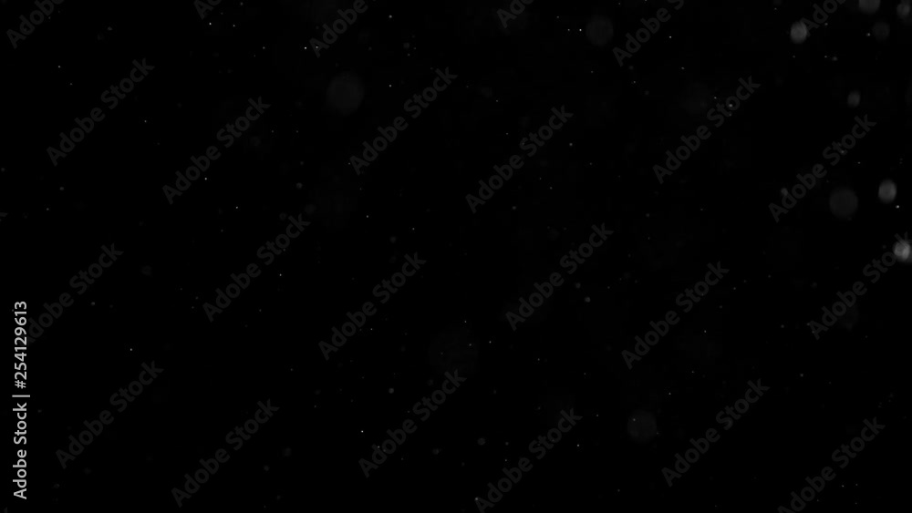Gust of Wind Snow. Small white particles flow in the air on a black ...