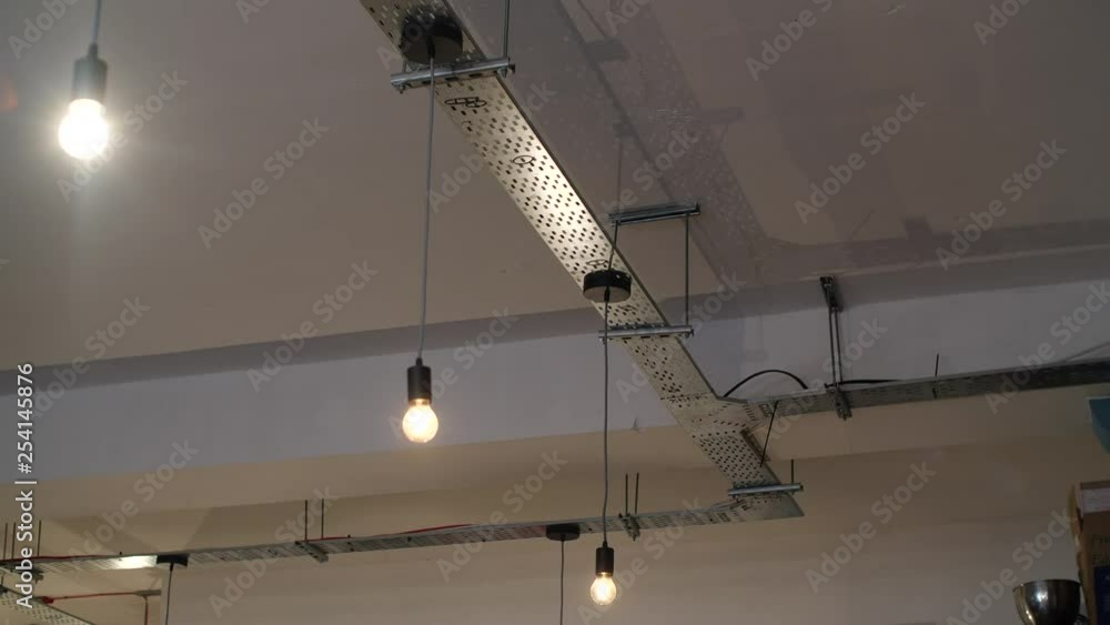 A static shot of an industrial office ceiling, the metal pillar ...