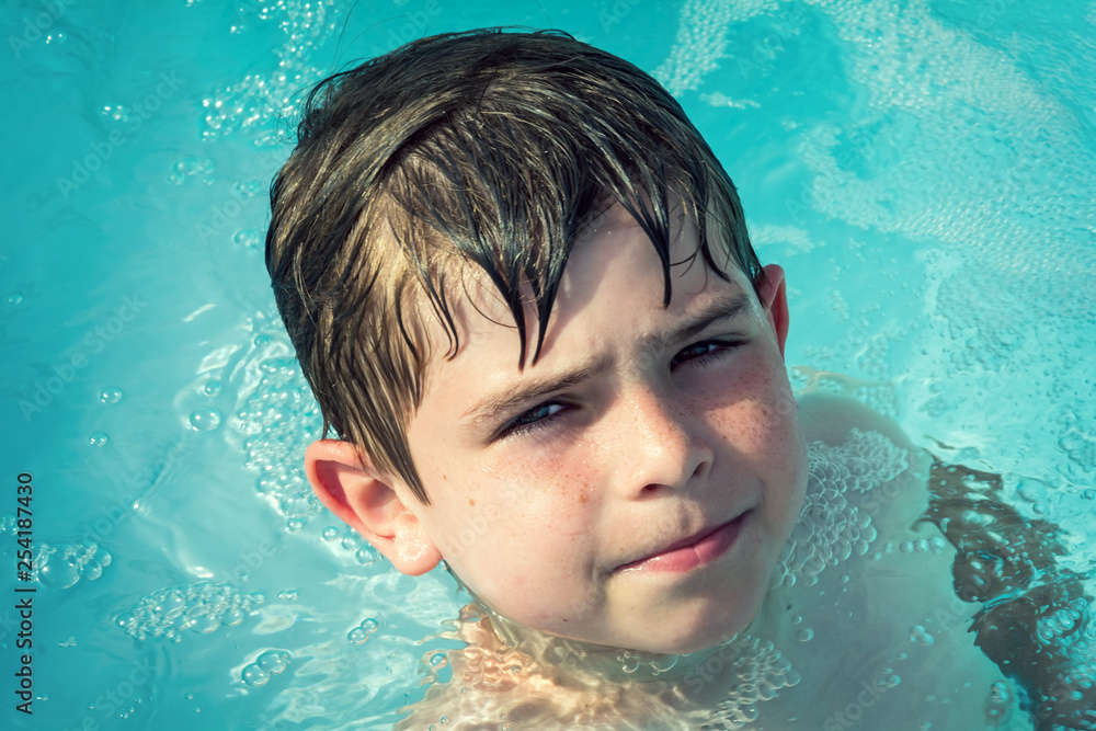 little boy in swimming pool Stock Photo | Adobe Stock