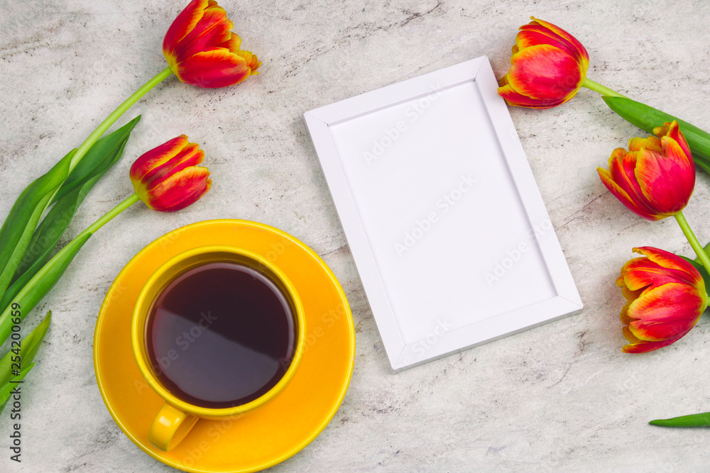 cup of drink ,empty white mocl up frame and tulips on marble table, top ...