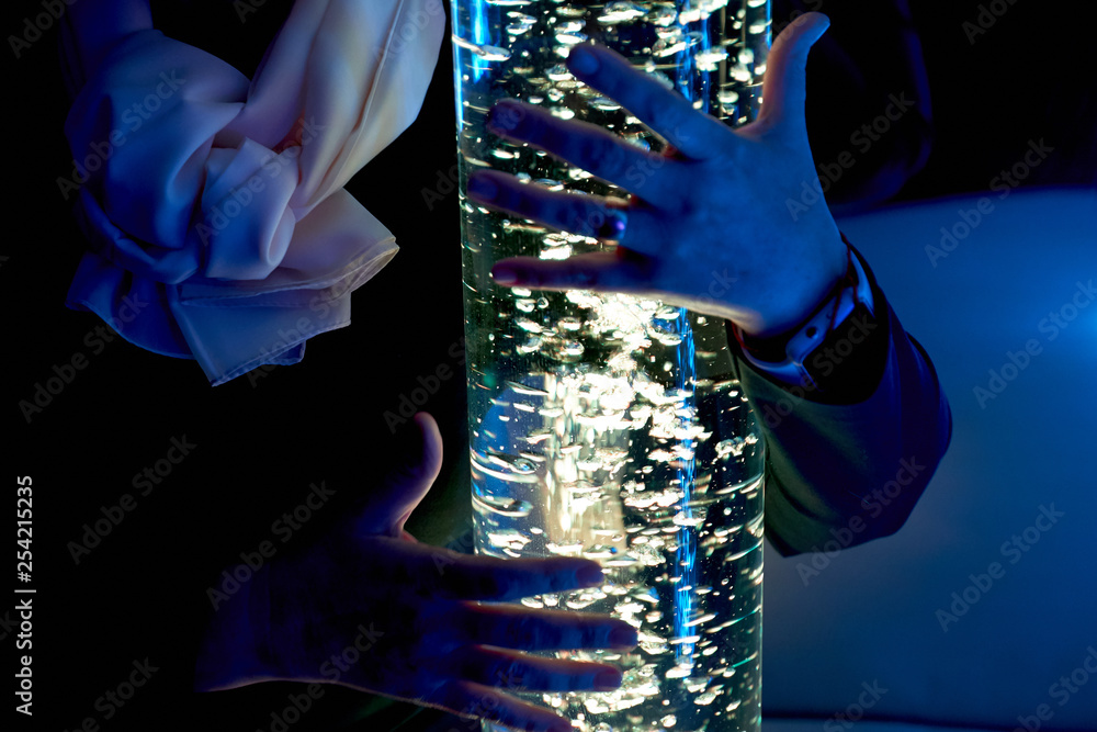 therapy sensory stimulating multi sensory room, woman interacting with ...