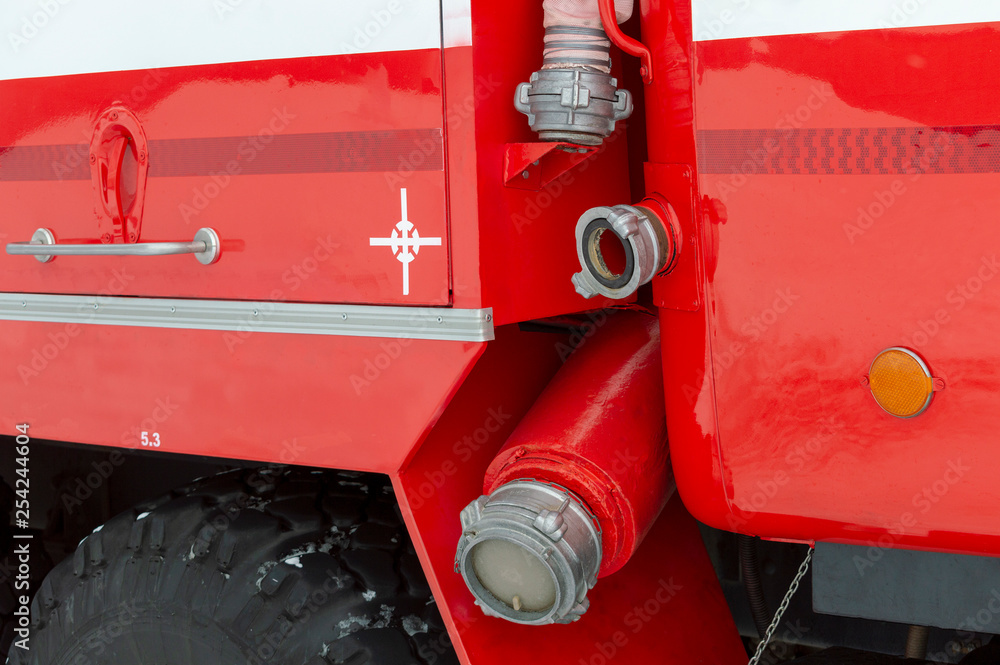 Drain or drain pipe on a red fire truck. Close up Stock Photo | Adobe Stock
