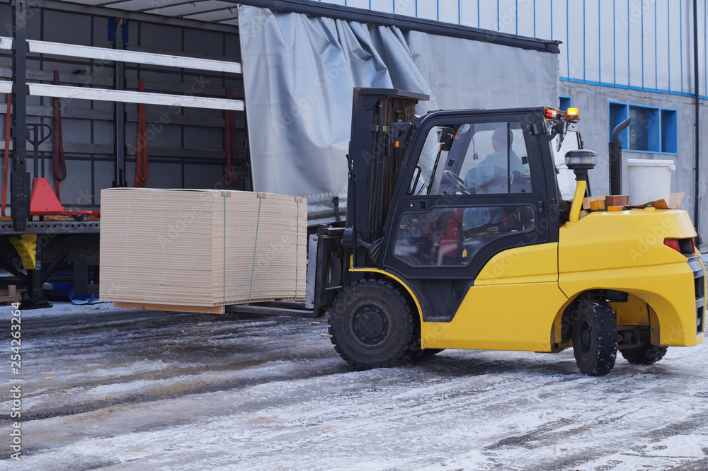 Forklift during unloading of a semi-trailer truck. Transport. Stock ...