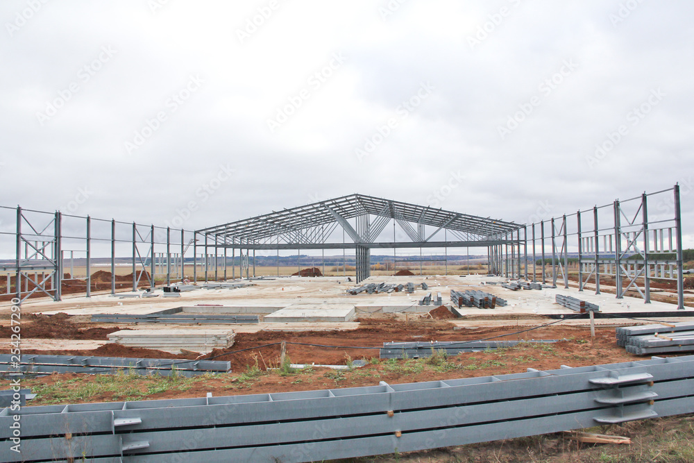 Structure of building from galvanized metal. Steel construction on sky ...