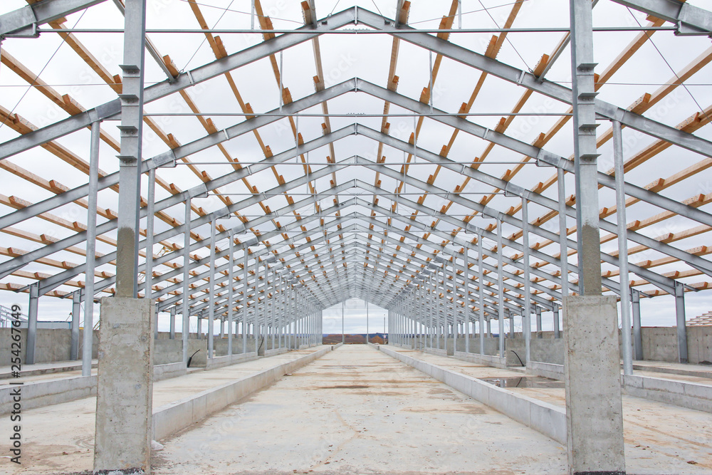 The frame of the roof of the new barn for cows. Construction of a new ...