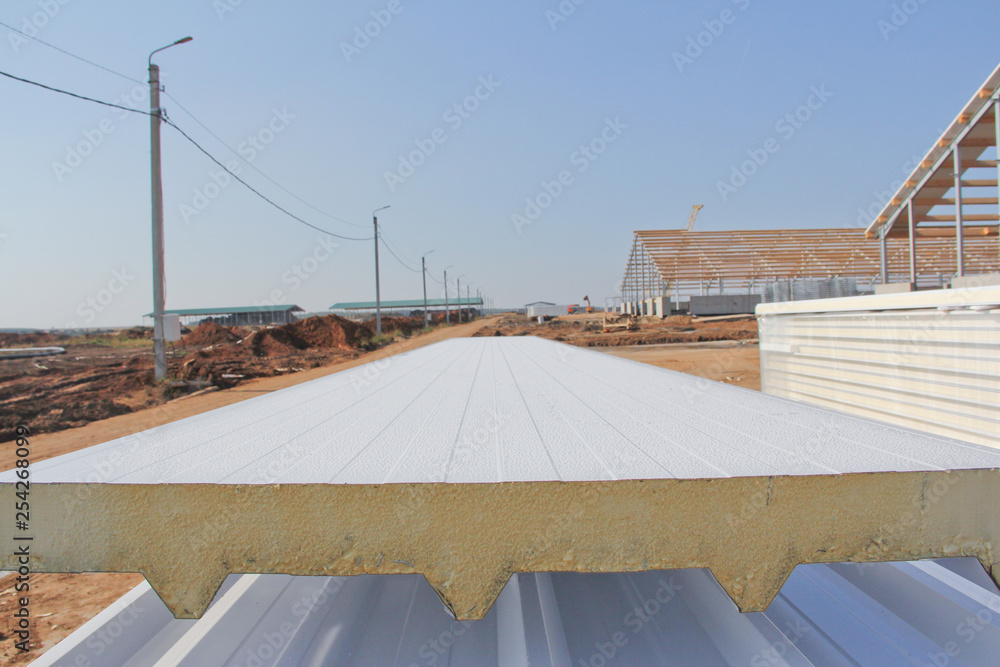 Sandwich panels at the construction site. Material for warming the ...