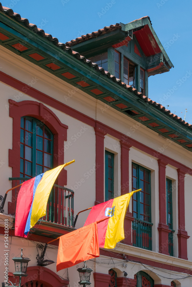 Bogota flags of Colombia in the facade of a colonial building in the ...