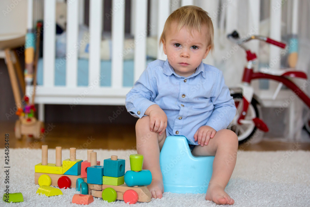 Cute toddler boy, potty training, playing with his teddy bear Stock ...