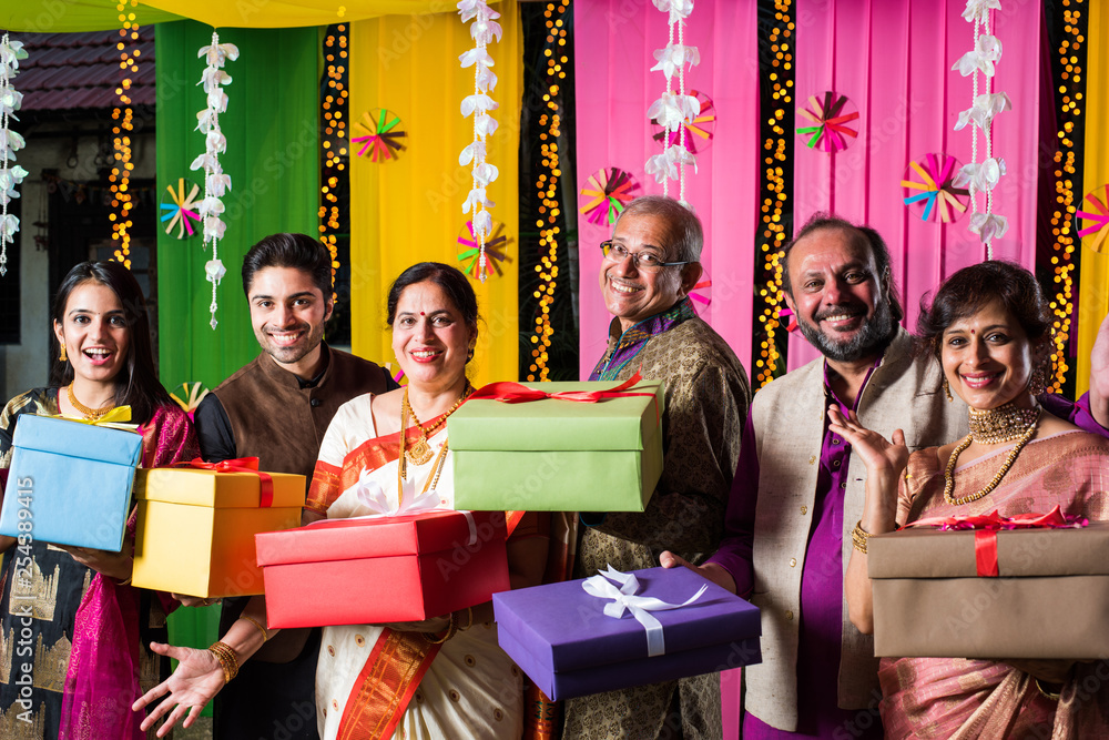 Indian family exchanging / holding Gift boxes on Diwali festival ...