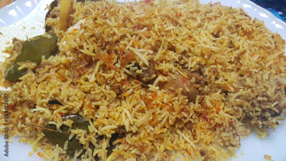 A close up view of cooked rice chicken biryani made with traditional ...