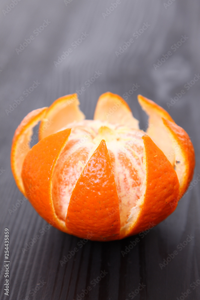 peeled orange fruit citrus tankan against black background Stock Photo ...