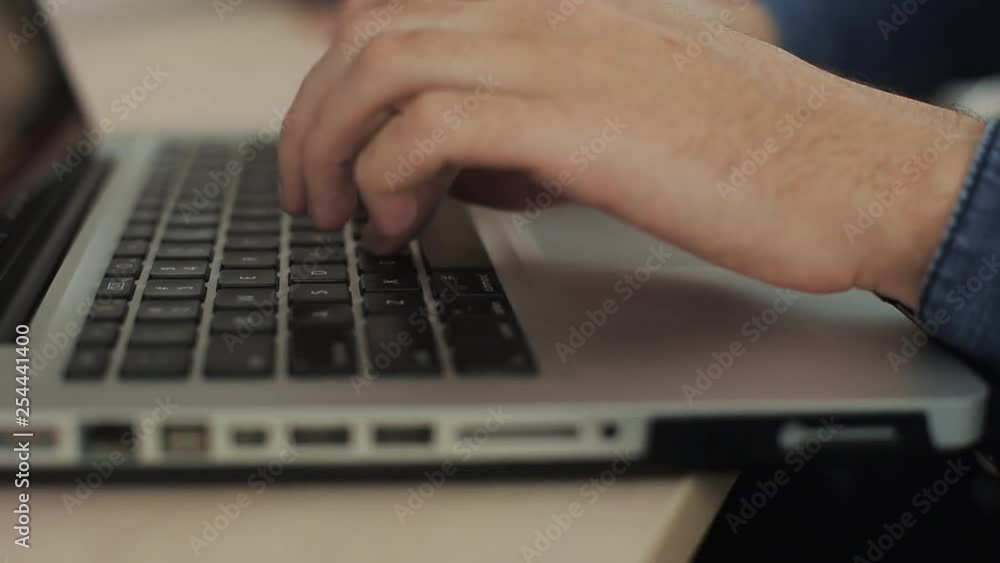 Close up male hands typing on keyboard Blurry background. Fingers on ...