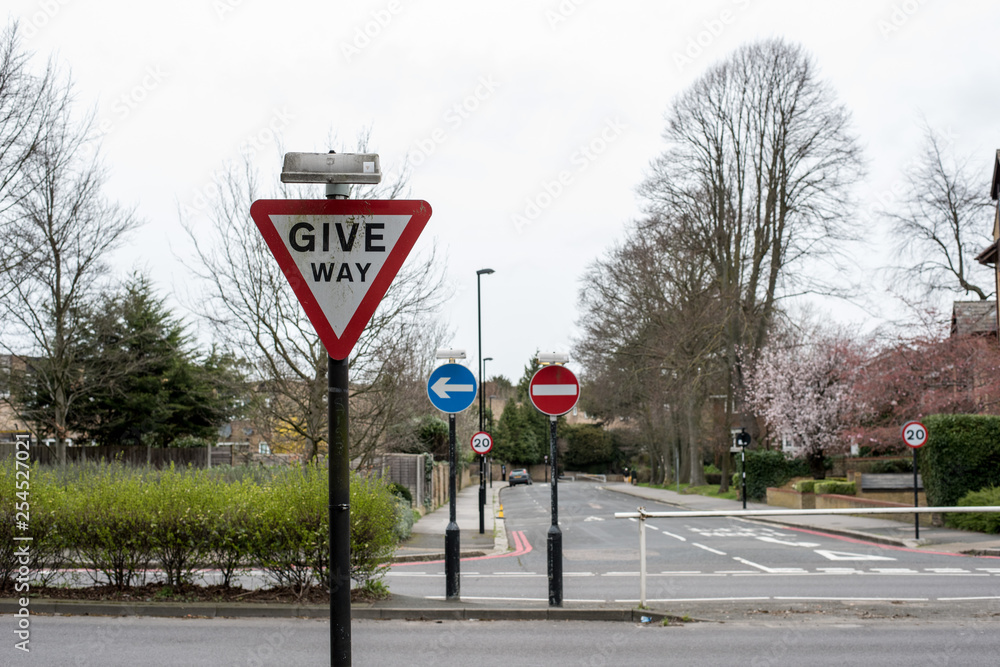 London, UK - March 2019: UK road signs showing speed, give way, one way ...
