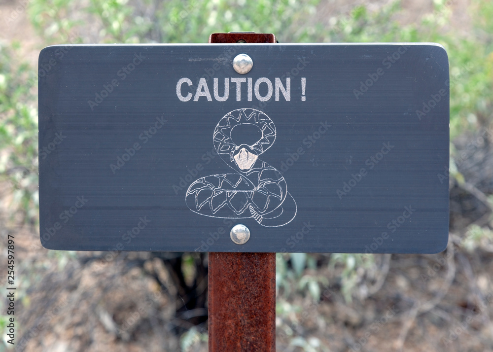CAUTION RATTLESNAKE warning sign in Arizona desert. Stock Photo | Adobe ...