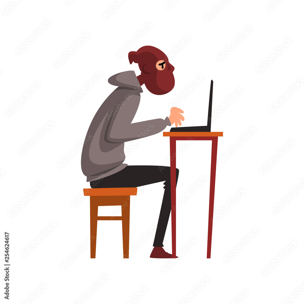 Hacker in Disguise Sitting at Desktop and Working on Laptop, Internet ...