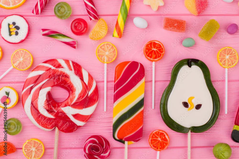 Composition with large sweet lollipops and candies. Dessert concept ...