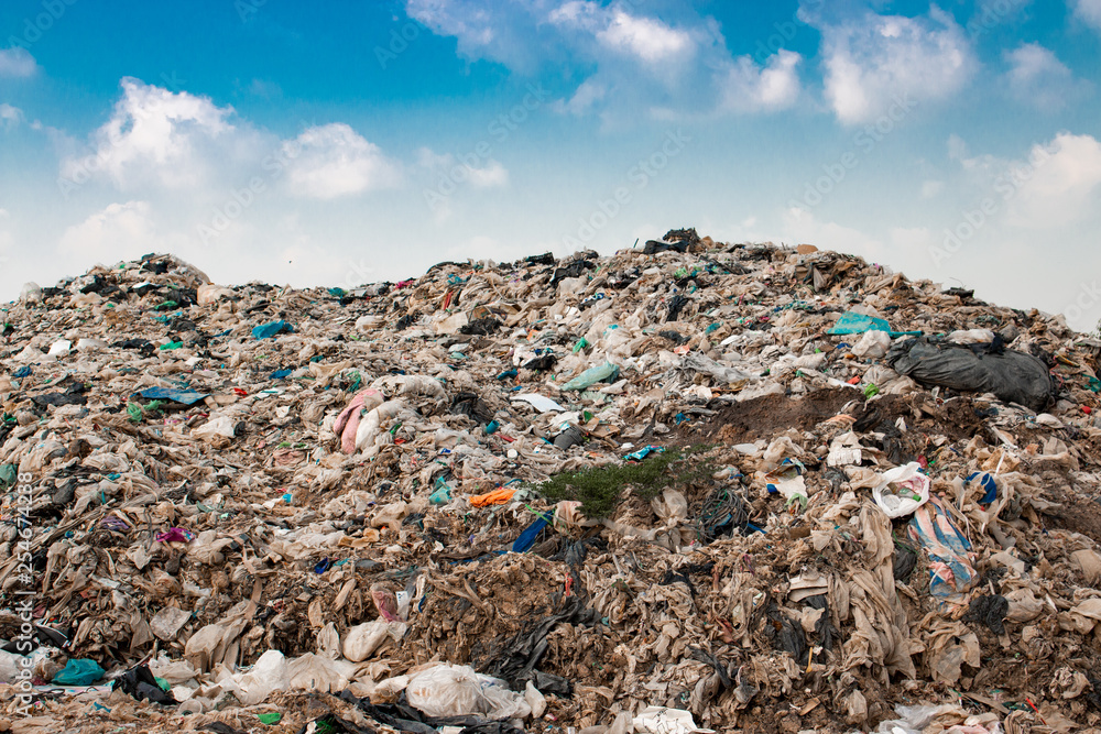 big garbage mountain with blue sky background Stock Photo | Adobe Stock