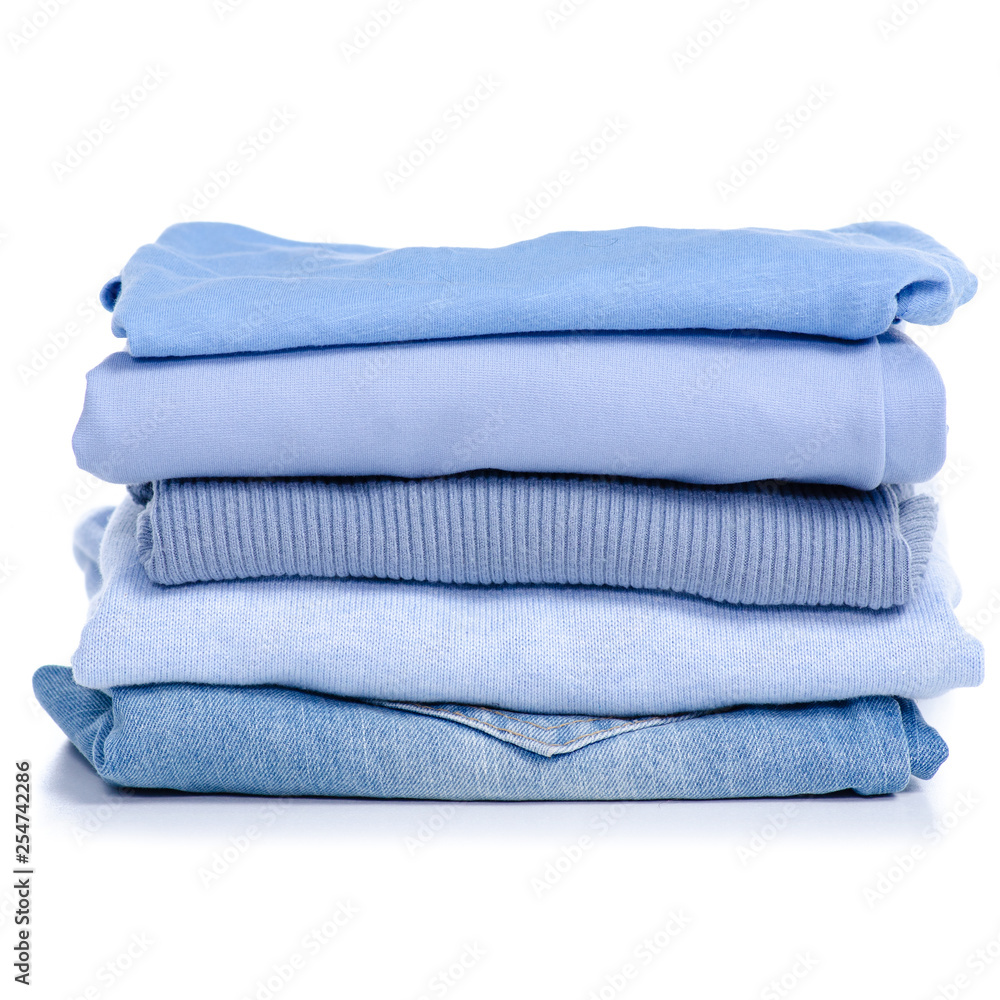 Stack blue clothes and jeans on white background isolation Stock Photo ...