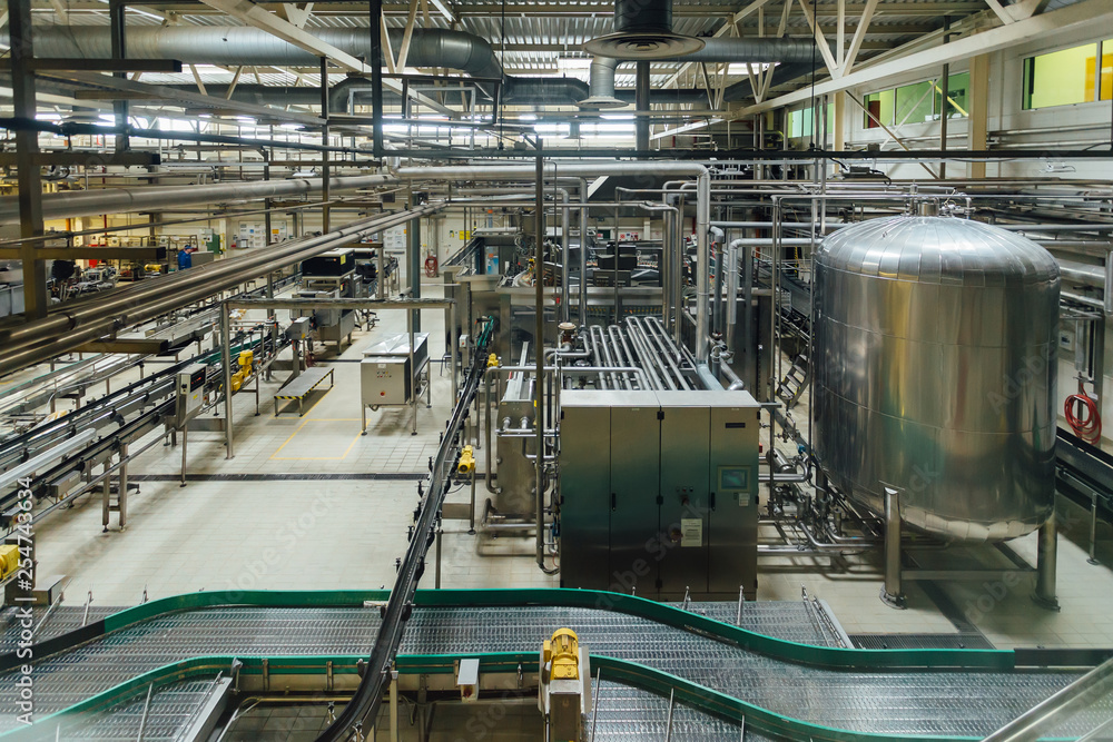 Modern brewery production line. Large vat for beer fermentation and ...