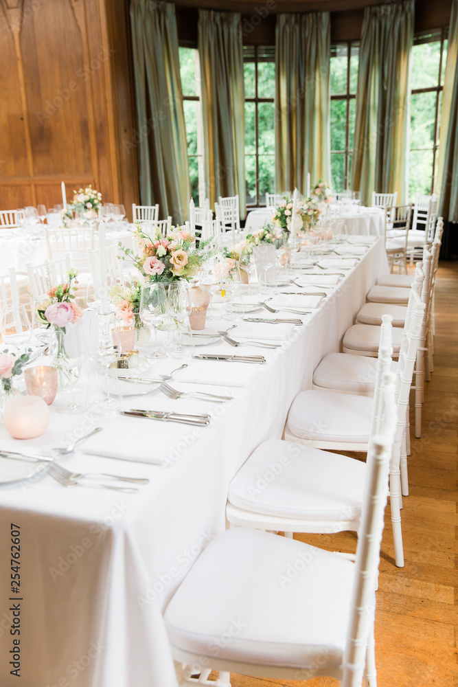 Formal place settings and tables ready for guests Stock Photo | Adobe Stock
