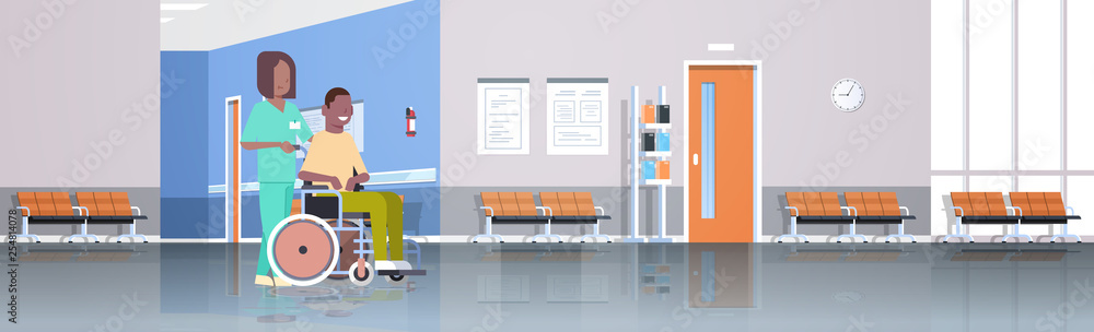 disabled man patient in wheelchair with nurse walking in hospital ...