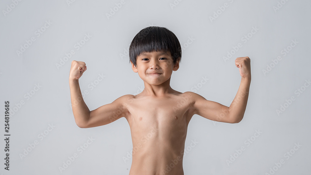 boy showing his hand biceps muscles Stock Photo | Adobe Stock