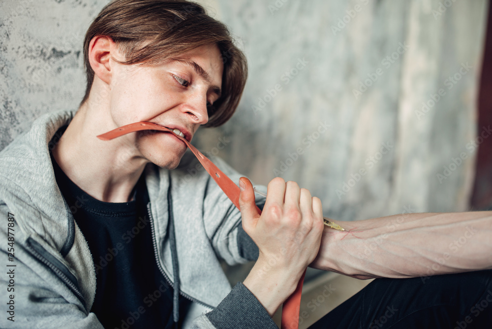 Man drug addict doing an injection dose in the arm Stock Photo | Adobe ...