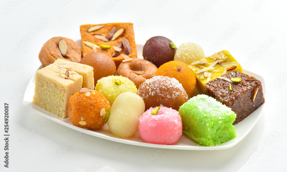 Mix Sweets in Dish, A large variety of Pakistani Mithai Stock Photo ...