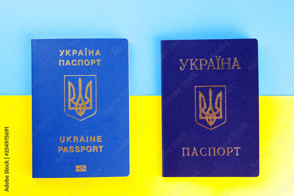 Ukrainian Biometric Passport And Internal Passport On Background Of The Ukrainian Flag Passport