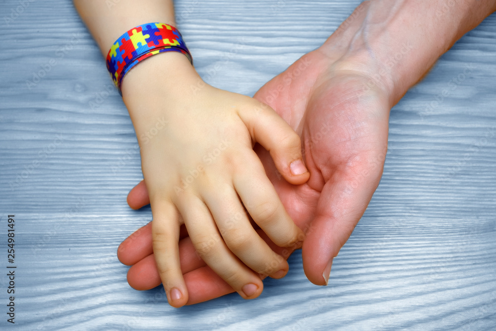 Autism Awareness Picture. Father holding hand her Autistic Child Stock ...