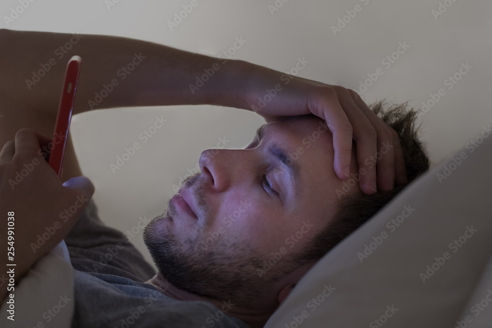 Addiction, nomophobia, insomnia, sleep disorder concept. Male addicted ...