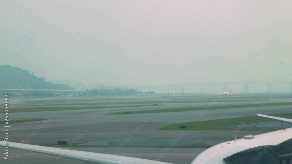 Airplane driving on runway for taking off in airport terminal. Aircraft ...