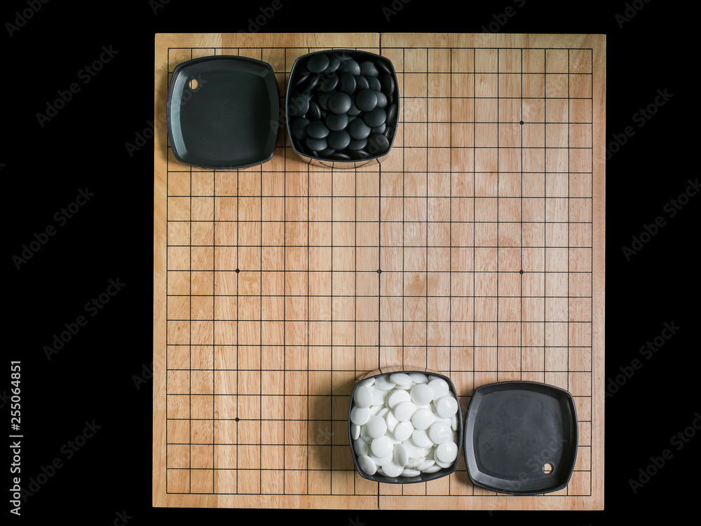 top view of wood board with black white stones,Go game(Weiqi,Baduk ...
